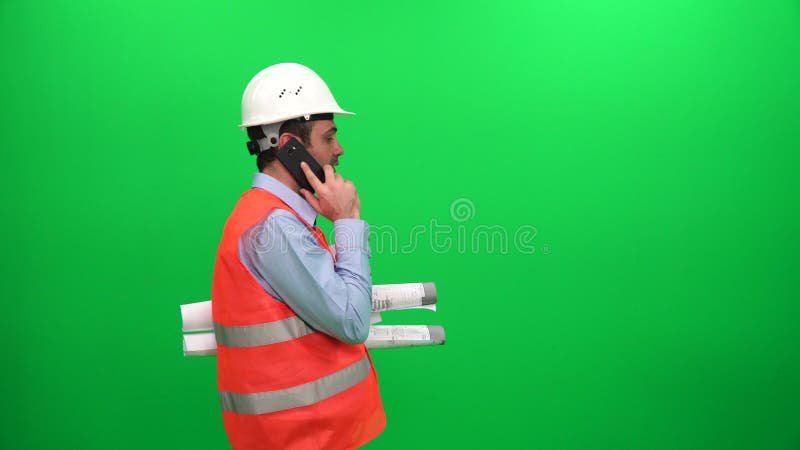 Engineer Worker with Blueprints Talking with Cell Phone, Green Screen ...