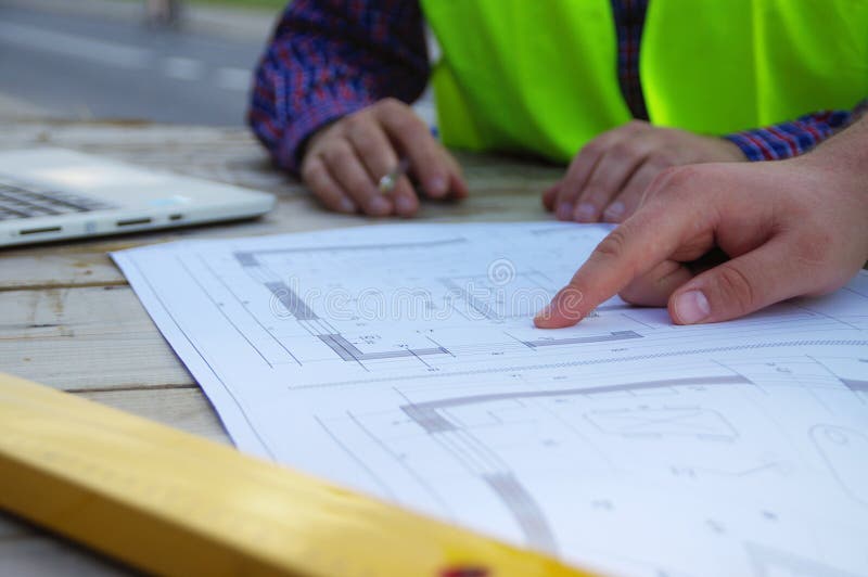 Teamwork Success. Engineer and Worker at a Construction Site Stock ...
