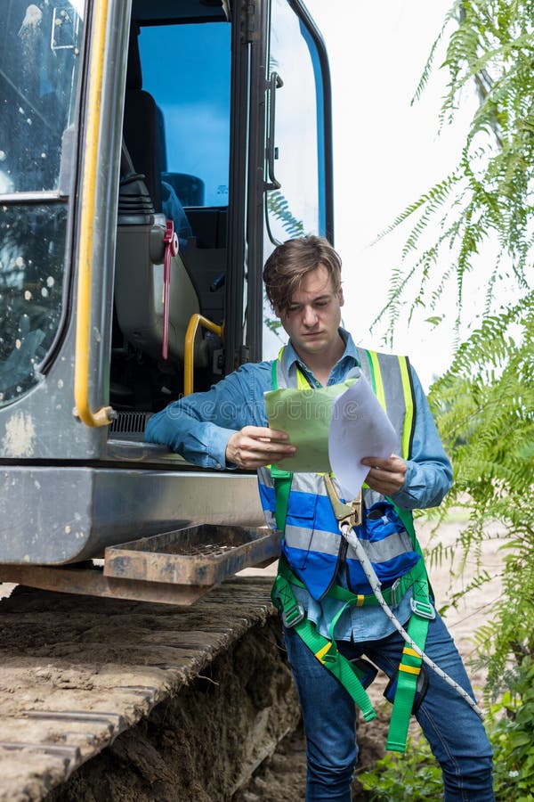 Engineer or Worker Reading Manual or Work Order before Driving ...