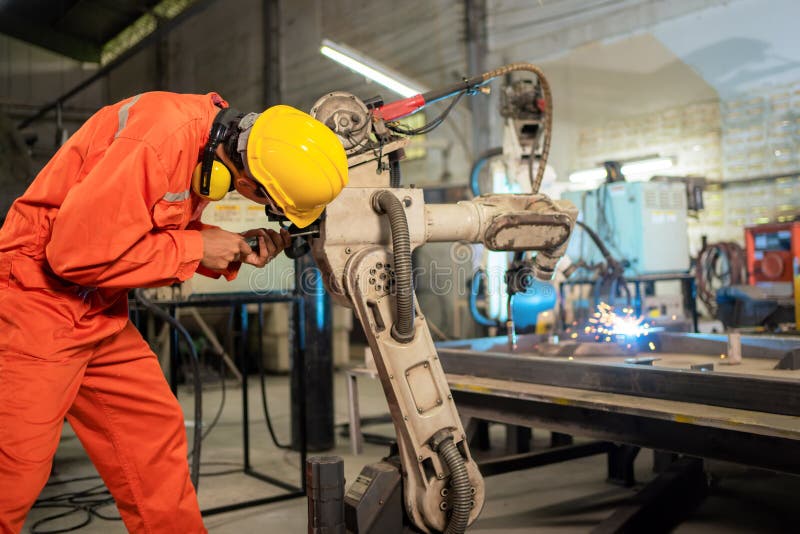 Engineer Worker Repair the Arm Robot Machine. Preventive Maintenance in ...