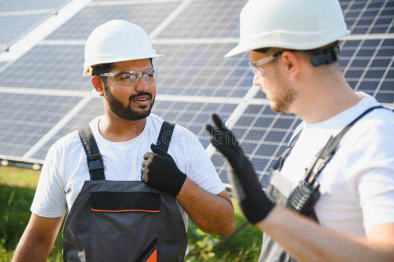 Engineer Worker Working in Solar Panels Power Farm. Two Technician ...