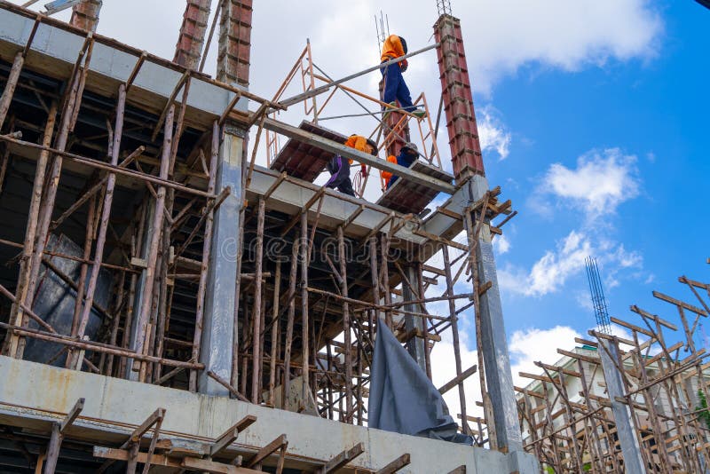 Engineer and Workers in Construction Team Building at Site Stock Image ...