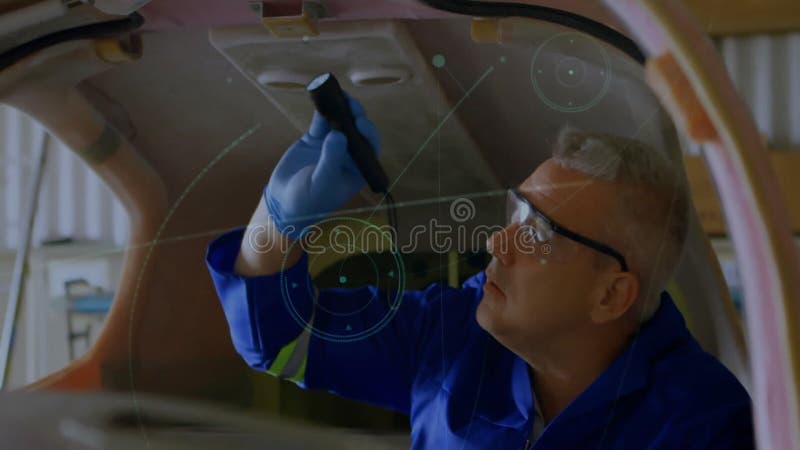 Engineer Working on Aircraft Cockpit with Technical Schematics ...
