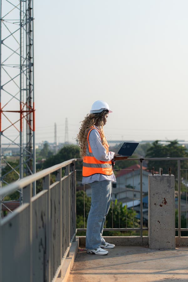 Engineer Working on a Building Site the Telephone and Internet Network ...