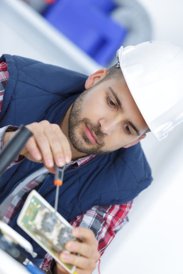 Engineer Working on Circuit Board with Driverc Stock Photo - Image of ...