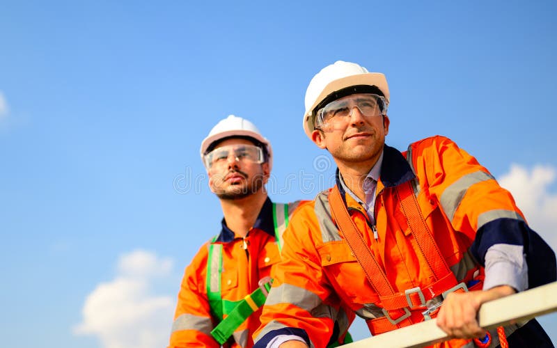 Engineer Working with Confident. Worker Outdoor Working. Mega Project ...