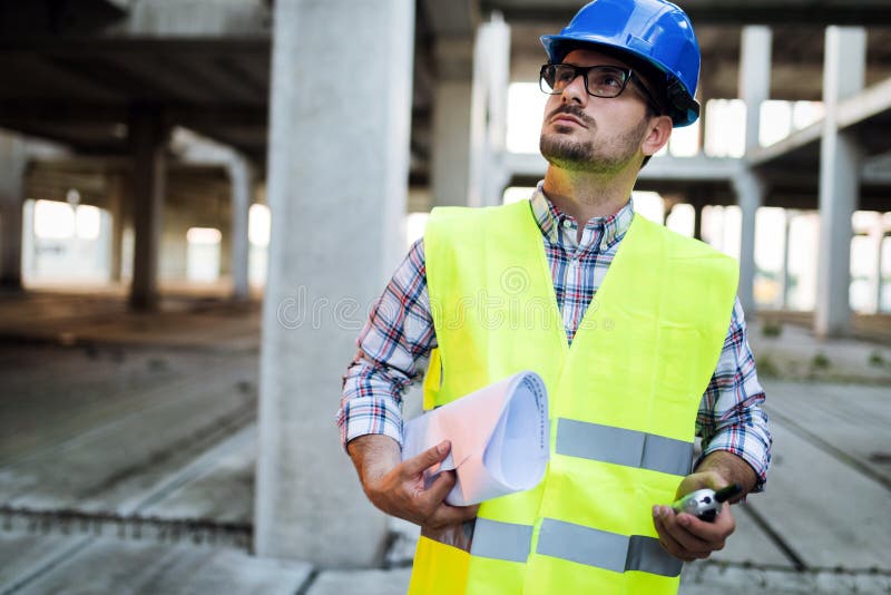 Engineer Working on Construction Site and Holding Blueprint Stock Image ...