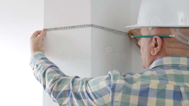 Engineer Working in a Construction Site Use a Tape Measure and Check ...