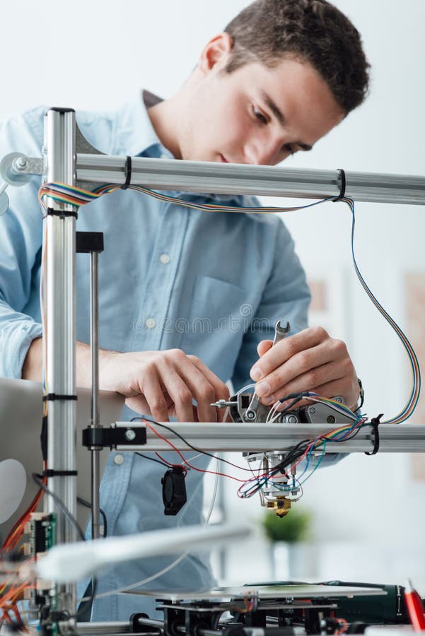 Young Engineer Working on a 3D Printer Stock Photo - Image of design ...