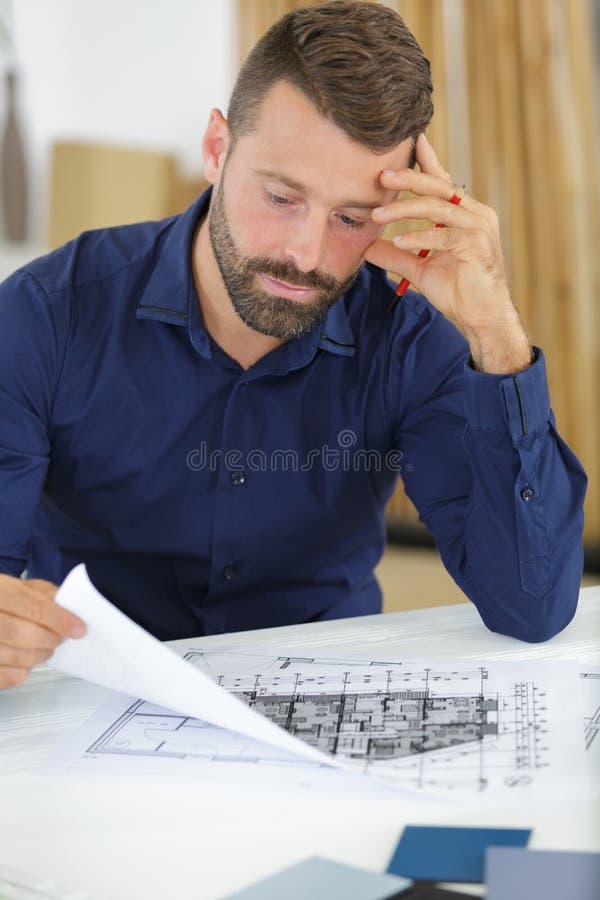 Engineer Working on Desk with Drawing Plan Stock Photo - Image of ...