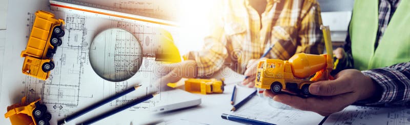 Engineer Working at a Drawings of House in Office for Discussing ...