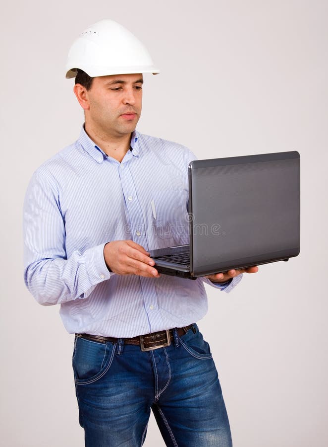 Engineer Working in a Laptop Stock Photo - Image of helmet, computer ...