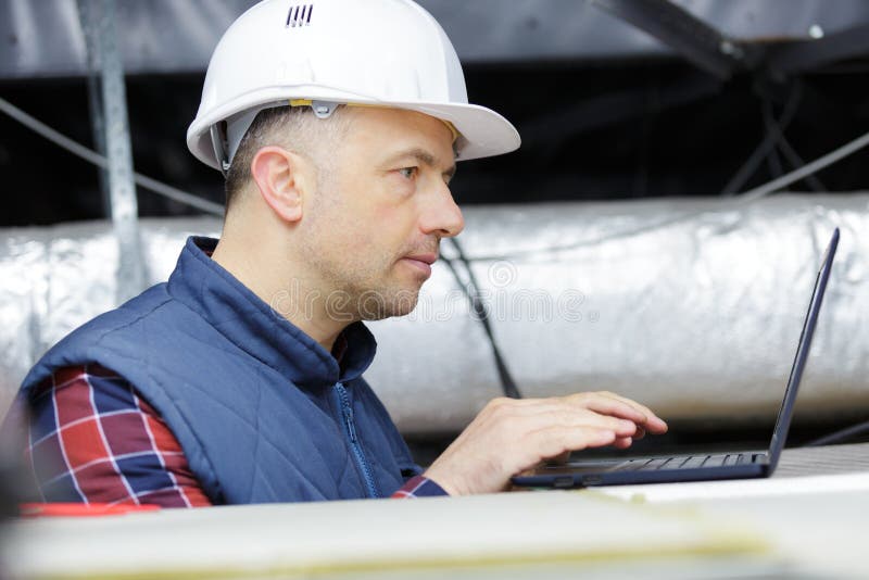Engineer Working with Laptop in Ceiling Stock Image - Image of male ...