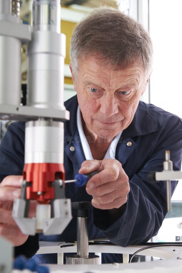 Engineer Working on Machine in Factory Stock Photo - Image of machine ...
