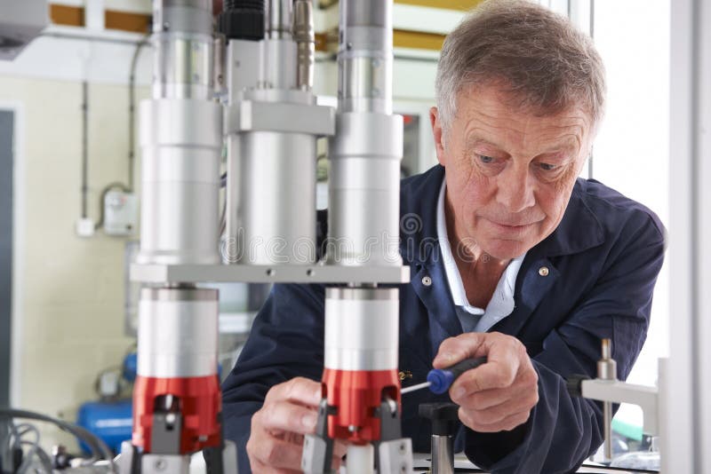 Engineer Working on Machine in Factory Stock Image - Image of workshop ...