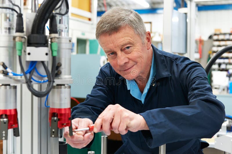 Engineer Working on Machine in Factory Stock Image - Image of worker ...