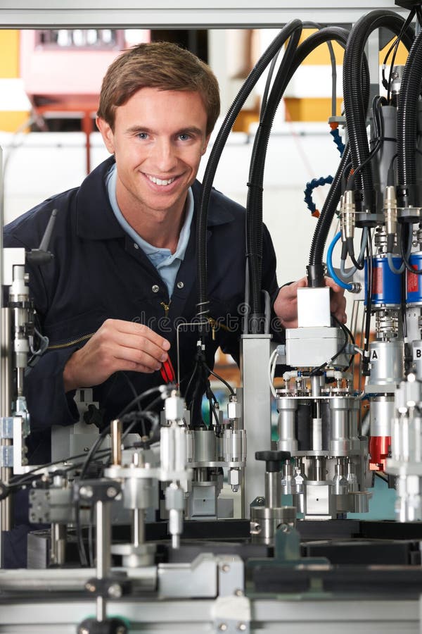 Engineer Working on Machinery in Factory Stock Photo - Image of ...
