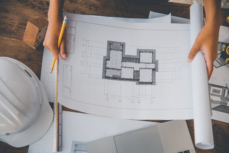 Engineer Working in Office with Blueprints, Inspection in Workplace for ...