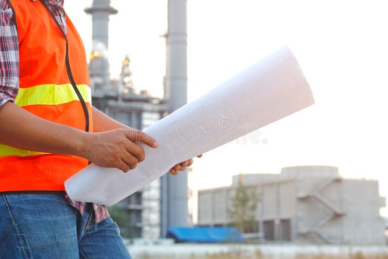 Engineer Working on Outdoor Checking Plan on Building Site Stock Photo ...