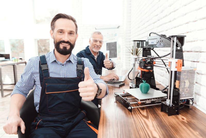 An Engineer in a Working Overall Posing in a Technical Laboratory ...
