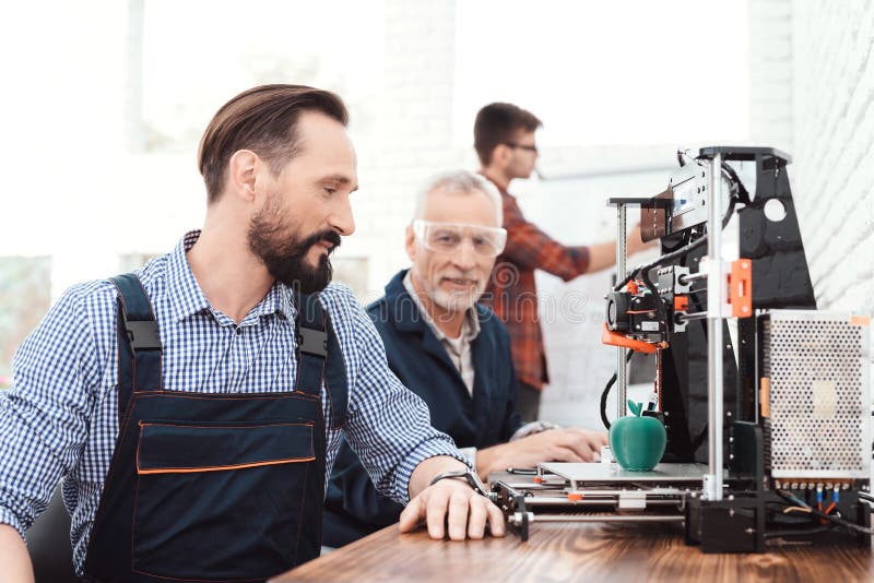 An Engineer in a Working Overall Posing in a Technical Laboratory ...