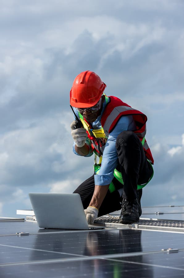 Engineer Working Setup Solar Panel at the Roof Top. Engineer or Worker ...