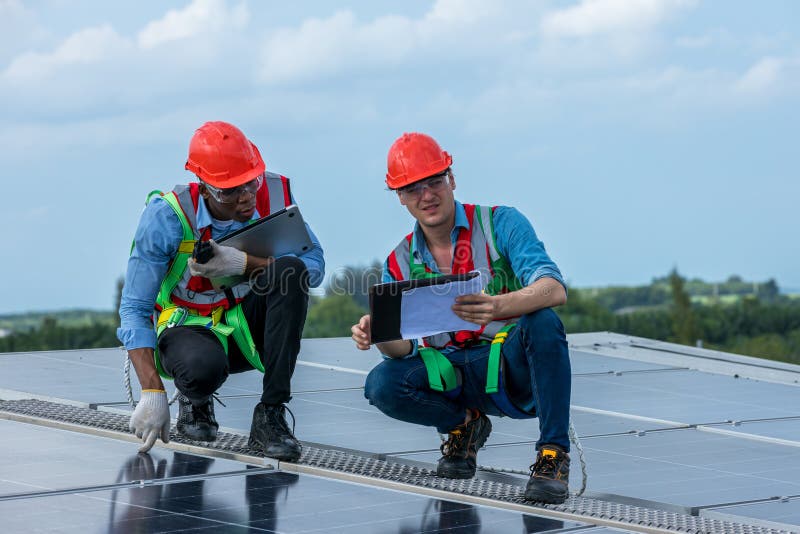 Engineer Working Setup Solar Panel at the Roof Top. Engineer or Worker ...