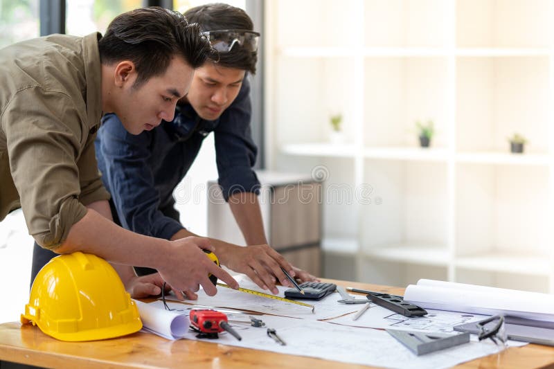 Engineer Working Together Draw Calculate Plan a Construction Project ...