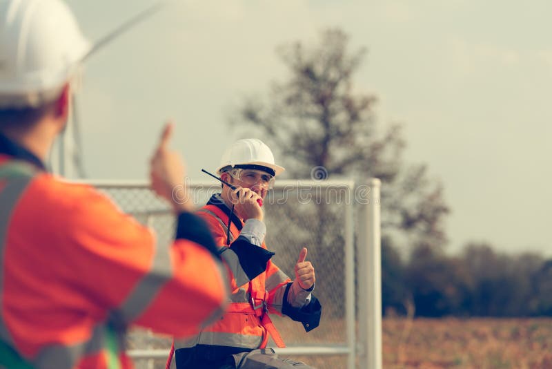 Engineer Working at a Wind Farm for Renewable Energy Has the ...