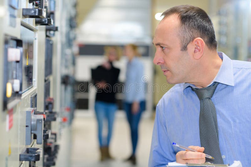 Engineer Writing on Clipboard in Factory Stock Image - Image of ...