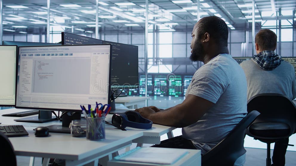 Engineer Writing Code and Doing Checkup on Server Room Stock Image ...