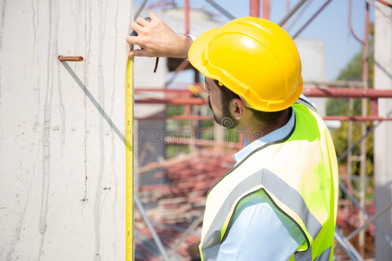Engineer Young Man Using Tape Measure for Check and Examining Length of ...