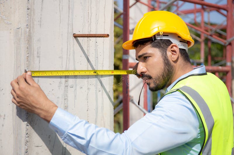 Engineer Young Man Using Tape Measure for Check and Examining Length of ...