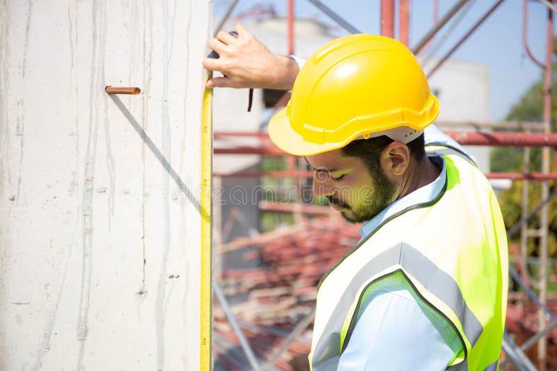 Engineer Young Man Using Tape Measure for Check and Examining Length of ...