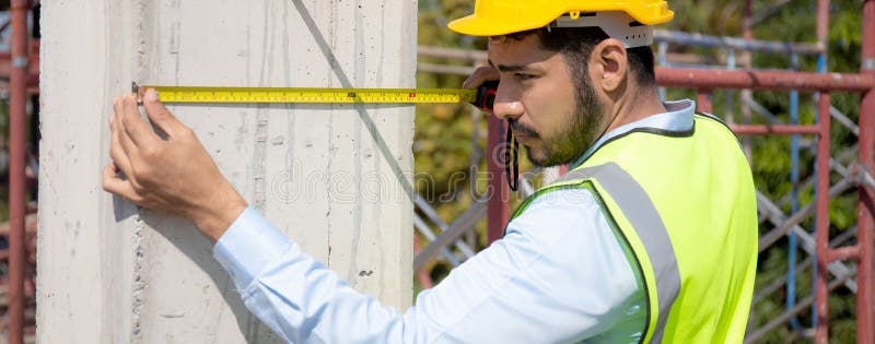 Engineer Young Man Using Tape Measure for Check and Examining Length of ...