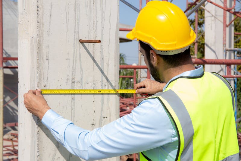 Engineer Young Man Using Tape Measure for Check and Examining Length of ...