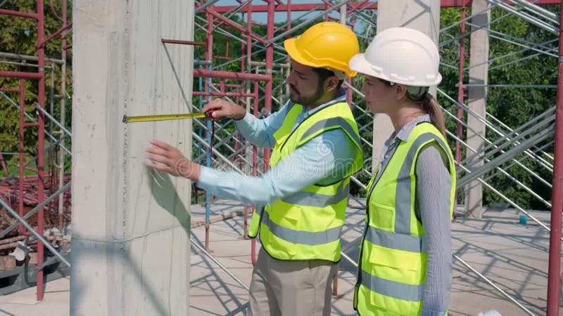 Engineer Young Man and Woman Using Tape Measure for Check and Examining ...