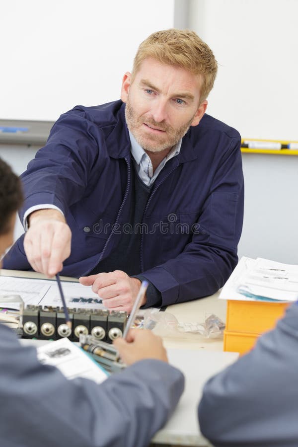 Engineering Apprentice Presenting To Group at Whiteboard Stock Image ...