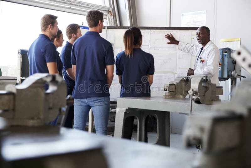 Engineering Apprentices Watching Presentation at Whiteboard Stock Photo ...