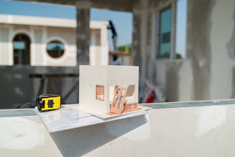 Engineering and Architect with House Model at the Construction Site ...