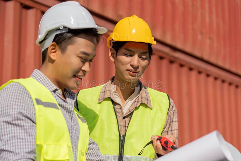Engineering Collaboration. Two Young Engineers Discussing Logistics ...