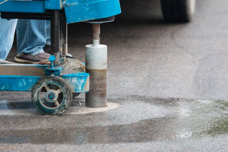 Engineering is Drilling the Road by Road Drilling Machine Stock Photo ...