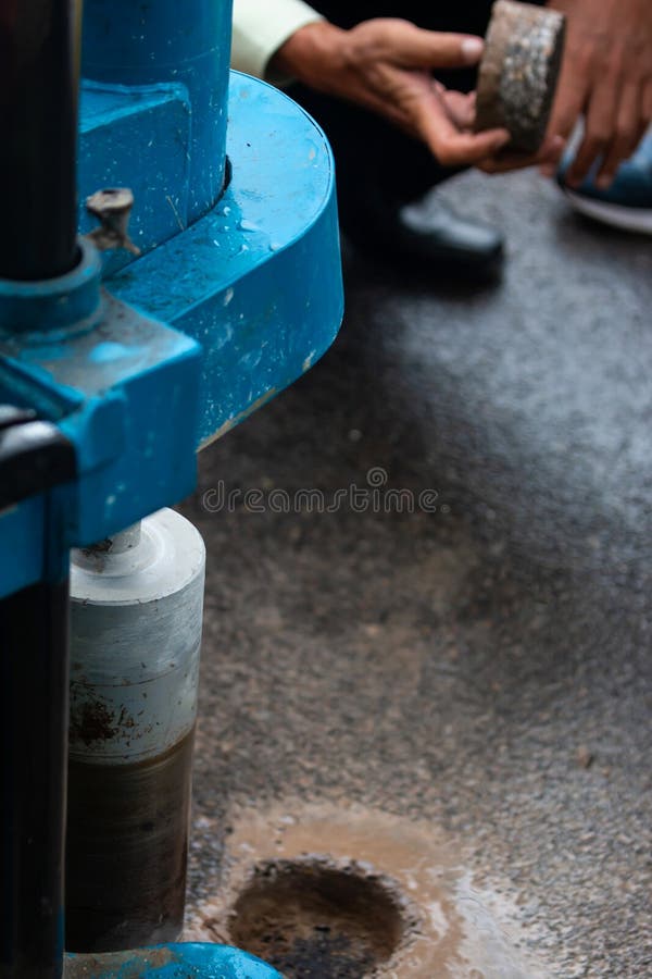 Engineering is Drilling the Road by Road Drilling Machine Stock Photo ...