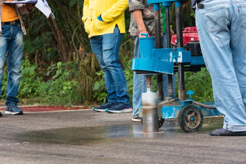 Engineering is Drilling the Road by Road Drilling Machine Stock Photo ...