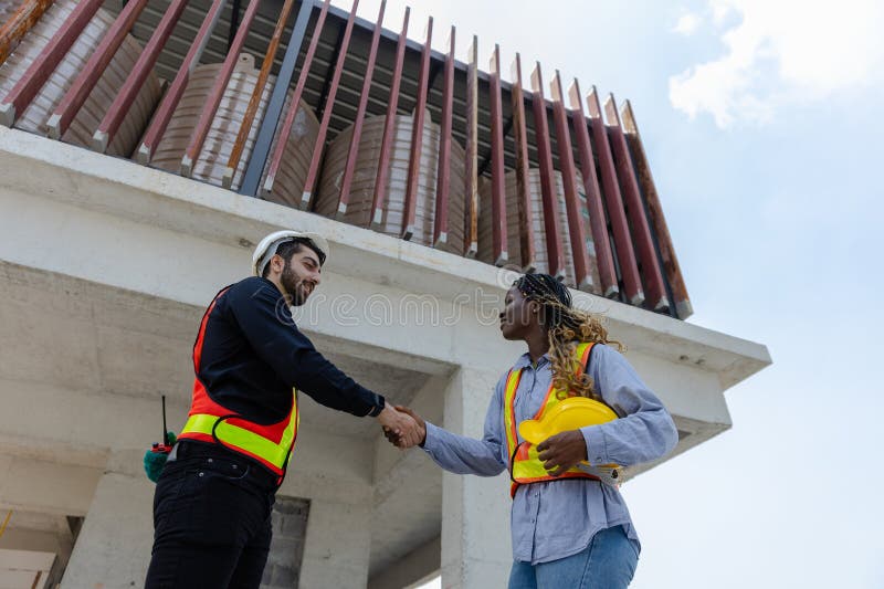 Engineering and Foreman Shaking Hands on Construction Site and Agree ...