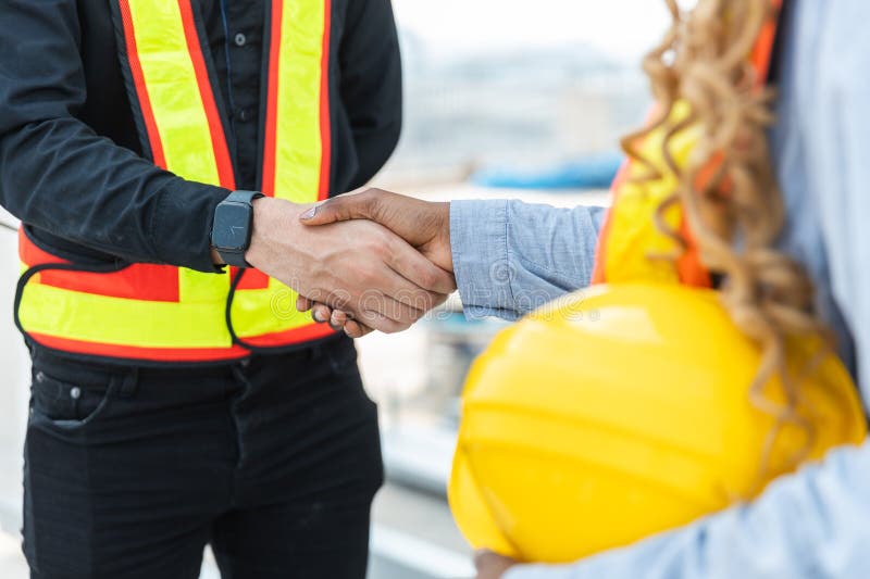 Engineering and Foreman Shaking Hands on Construction Site and Agree ...