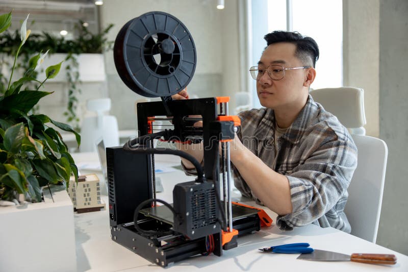Men Working with 3D Printer and Blueprint for Designing Mechanical ...