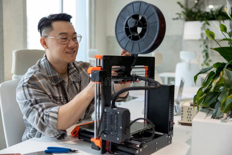 Men Working with 3D Printer and Blueprint for Designing Mechanical ...