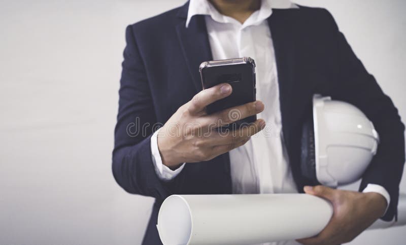 Engineering Man Holding a Drawing Paper and Safety Cap, in Concept of ...