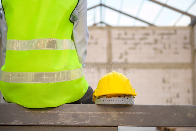 Engineering Man with Safety Helmet Siting Over Construction Site ...